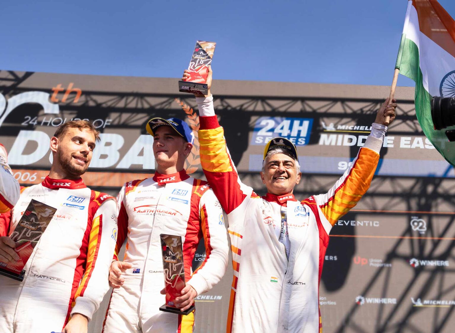 Ajith Kumar waves Indian flag after his win at Dubai car racing event ...